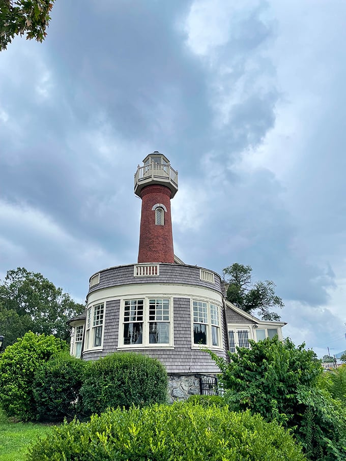 Up close, the lighthouse reveals its architectural personality&mdash;red brick tower rising from gray shingles like a distinguished gentleman wearing a colorful hat.