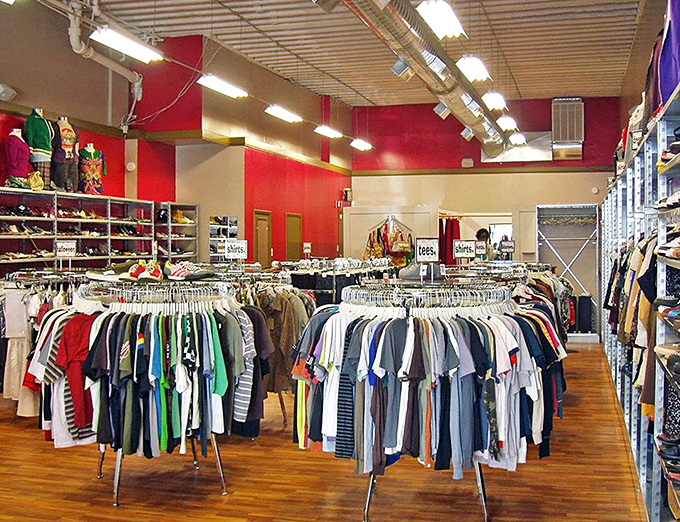Inside, circular racks spin fashion dreams into reality, organized by category like a well-planned treasure map.
