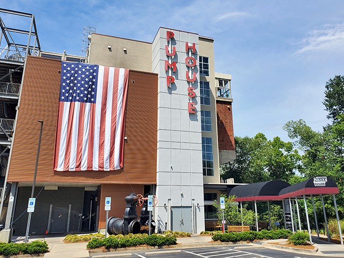 The Pump House stands proud with its massive American flag, a testament to Rock Hill's patriotic spirit and industrial heritage reimagined for modern enjoyment.