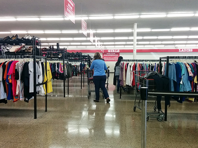 Treasure hunters navigate the well-organized clothing aisles, where yesterday's fashion finds new purpose and appreciation.