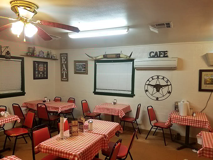 Red-checkered tablecloths and Texas memorabilia create the perfect backdrop for comfort food conversations. No interior decorator needed&mdash;just authentic charm.