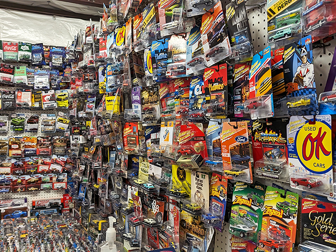 A collector's fever dream! This wall of miniature cars would make any grown adult suddenly remember why allowance money was invented in the first place.