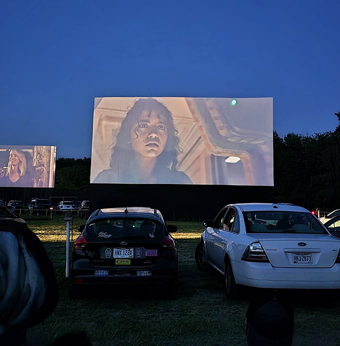 As darkness falls, the massive screen illuminates with Hollywood's latest offerings, creating a communal experience that Netflix could never replicate.