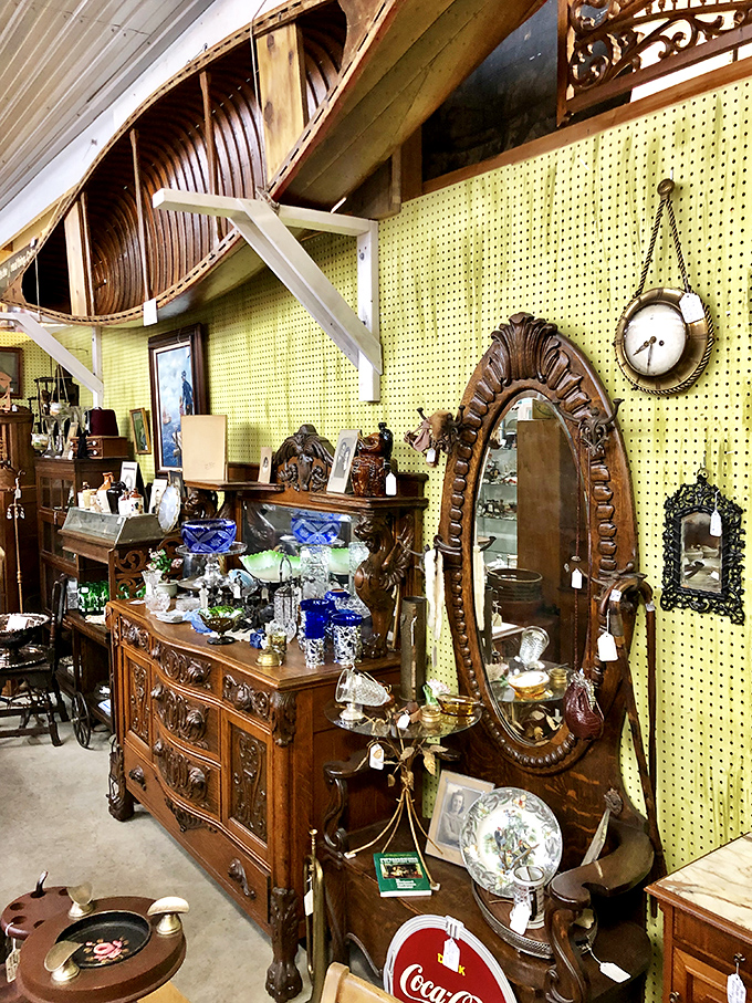 Look up! That's an actual wooden canoe suspended from the ceiling, proving this isn't your average shopping experience.