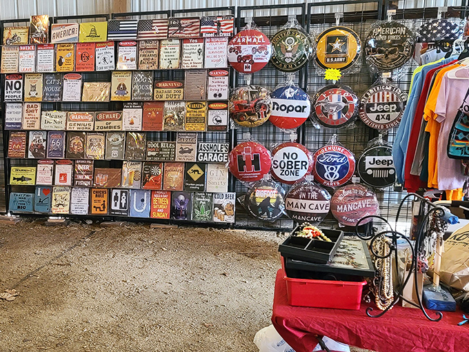 Man cave essentials galore! This wall of nostalgic signs and metal art offers everything from humorous warnings to vintage automotive logos that scream "character wall" for any garage.