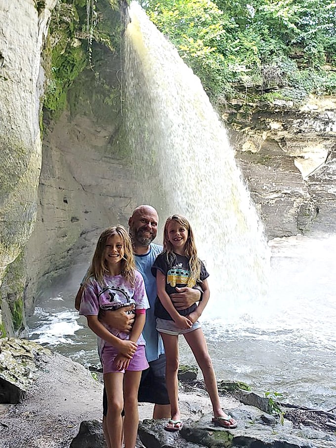 The waterfall provides a perfect backdrop for family memories. Nothing says "Minnesota summer" quite like getting splashed by a waterfall.