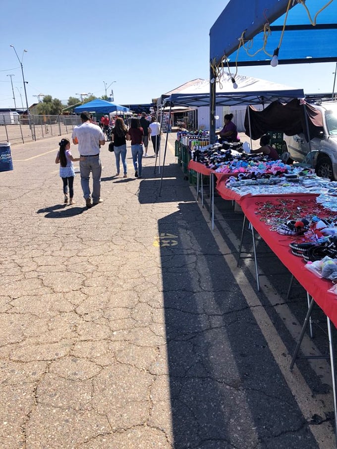 Families stroll through a wonderland of possibilities, where every table holds potential treasures waiting to be discovered.