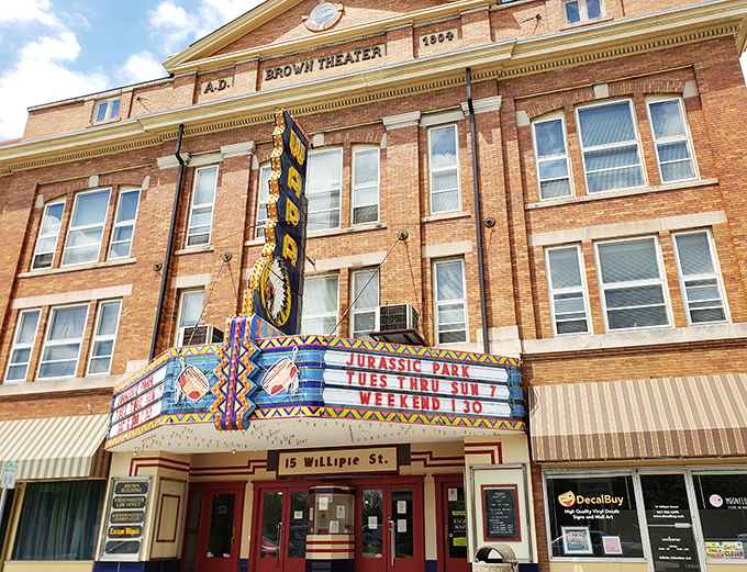 The Brown Theatre's magnificent marquee lights up Willipie Street, a cinematic treasure where movie tickets won't break the bank.