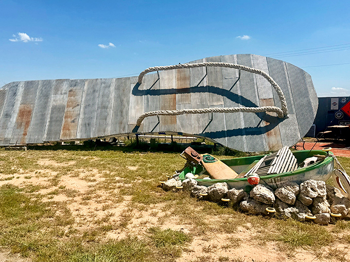 Constructed from weathered corrugated metal with rope straps, this colossal sandal would make Godzilla think twice about going barefoot.