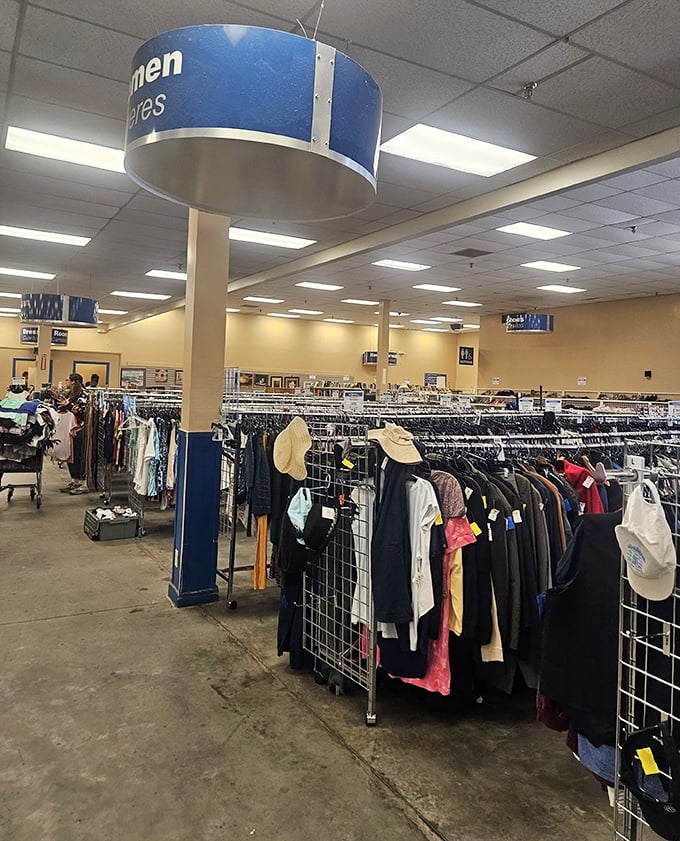 Navigate the well-organized clothing aisles where the "Men's" section sign hangs like a North Star for thrifters seeking sartorial treasures at earth-friendly prices.