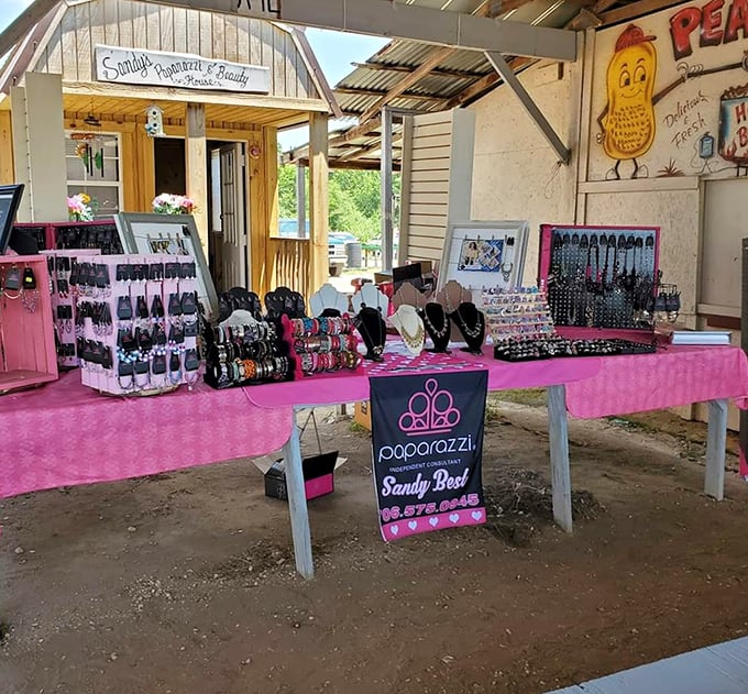 Paparazzi jewelry display that would make any accessory lover swoon. Pink tablecloths and organized displays prove treasure hunting can be both affordable and orderly.