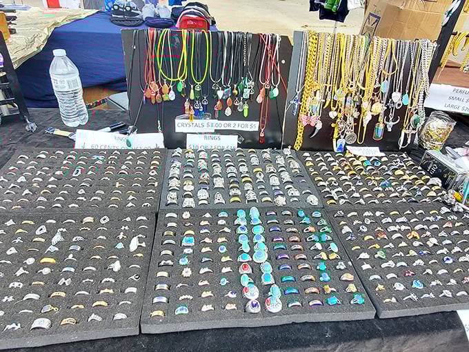 A jewelry vendor's display showcases hundreds of rings and necklaces&mdash;each tiny circle potentially someone's perfect accessory waiting to be discovered.