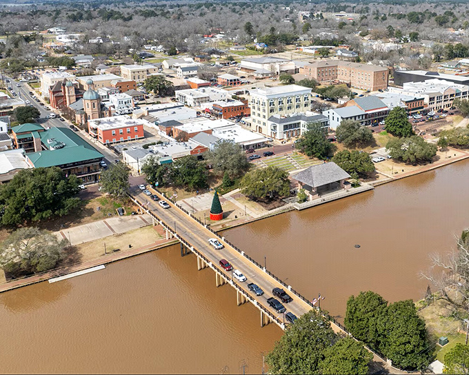 From above, Natchitoches reveals its perfect layout—a charming downtown hugging the Cane River like it's saving the best spot at Thanksgiving dinner.