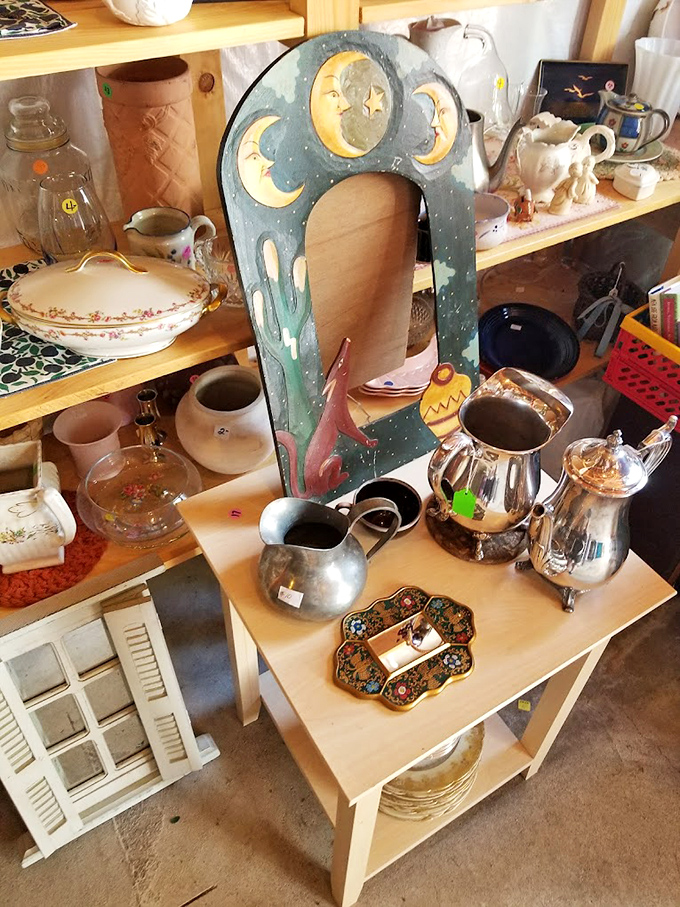Vintage treasures await new homes at this eclectic booth. That moon-adorned frame isn't just decoration—it's someone's future conversation piece.