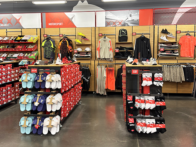 A rainbow of athletic slides stands at attention, ready to comfort feet that have logged miles in pursuit of the perfect deal.