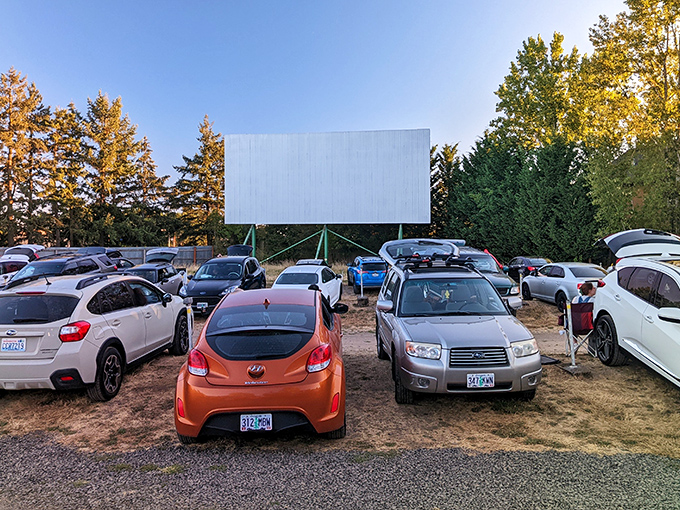 The modern world fades away as the massive white screen stands sentinel against the Oregon sky, promising escape under the stars.