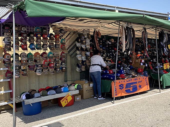 Baseball cap heaven! Like a colorful library of team loyalties where Dodgers fans and Giants supporters temporarily suspend their rivalries in pursuit of the perfect lid.