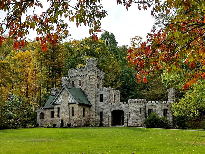 Fall foliage frames this stone masterpiece, creating a scene worthy of a fantasy novel cover or your next holiday card.