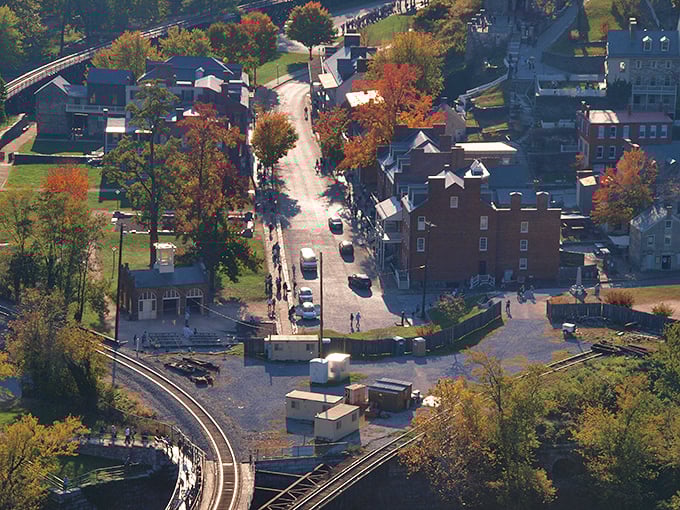 A bird's-eye view reveals Harpers Ferry's perfect positioning where two mighty rivers and three states converge, like nature's own crossroads of history.