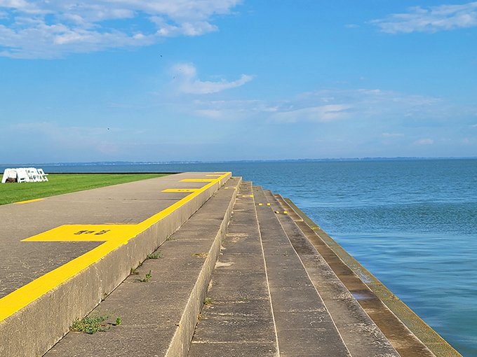 Where land meets water in perfect harmony. This concrete pier invites you to walk straight into Lake Erie's endless blue horizon.