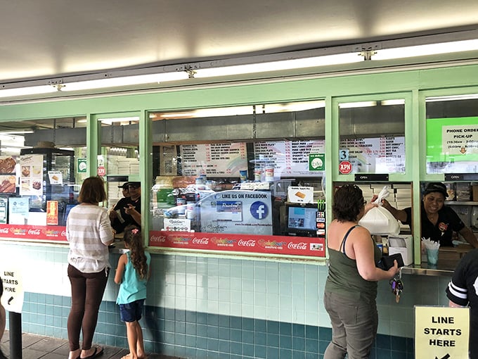 The ordering window &ndash; where locals speak in shorthand and tourists study the menu like it's a delicious final exam.