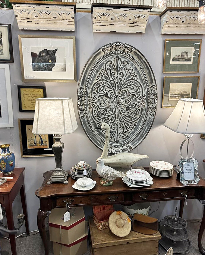 A perfectly curated vignette where every piece tells a story. That ornate oval medallion could have graced a European manor house.