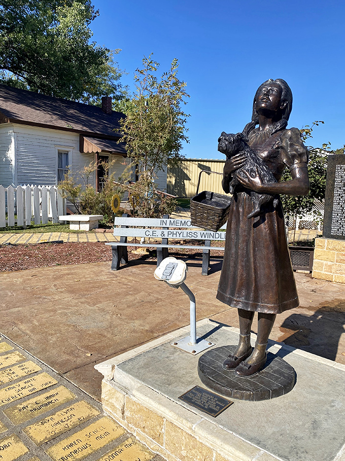 Dorothy forever frozen in bronze, basket in hand, ready for adventure. Even Toto knows this statue captures the essence of Kansas determination.
