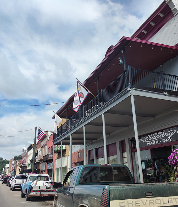 The Pomeroy Laundry building stands as a testament to simpler times. Those balconies aren't just for show&mdash;they're front-row seats to the daily river parade.
