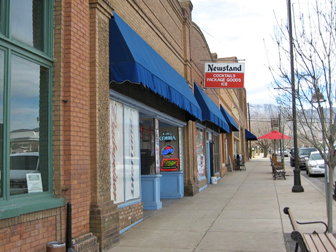 Blue awnings provide shade for window shoppers along Clarkdale's downtown strip. The newsstand still sells actual newspapers&mdash;remember those?