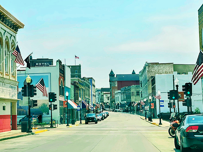 American flags flutter proudly along Ohio Avenue, where Sedalia's charming downtown offers the rare luxury of affordable small-town living with big-city character.