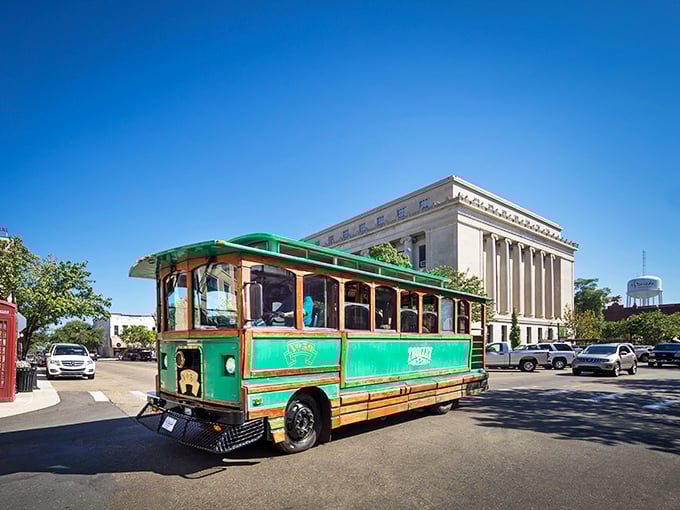 The emerald trolley glides past the stately courthouse, offering visitors a delightful ride through history without the blisters that usually accompany a walking tour.