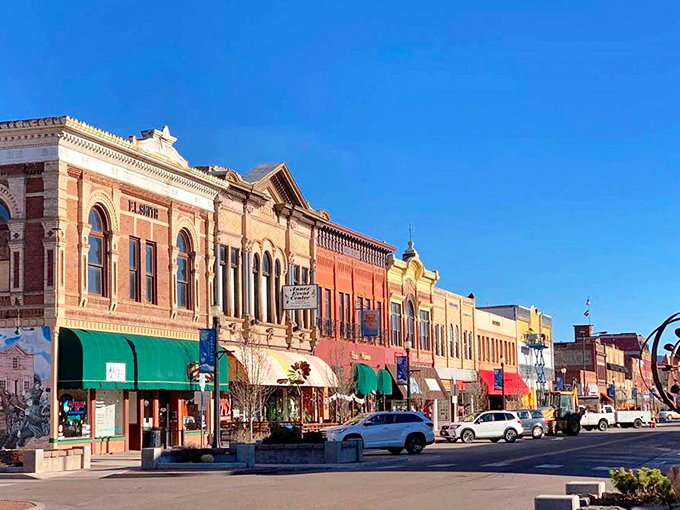 Historic buildings stand shoulder to shoulder along downtown, their colorful awnings like party hats celebrating over a century of Colorado stories.