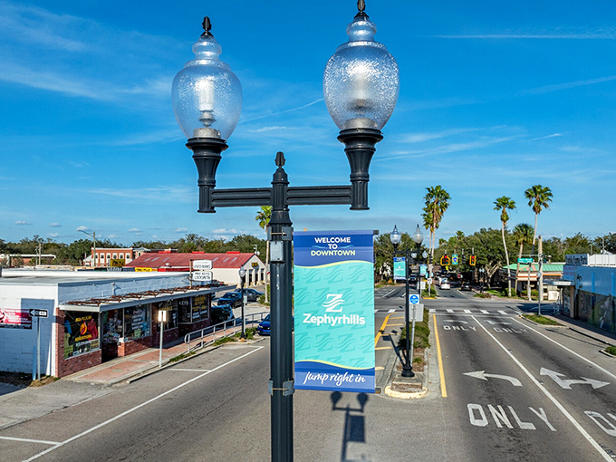 The "Welcome to Downtown" sign stands as a cheerful greeter against that impossibly blue Florida sky&mdash;no admission fee required for this view.