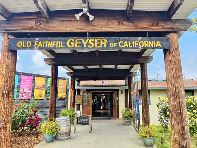 The welcoming entrance sets the stage for geological drama, with rustic beams and colorful signage promising natural wonders ahead.