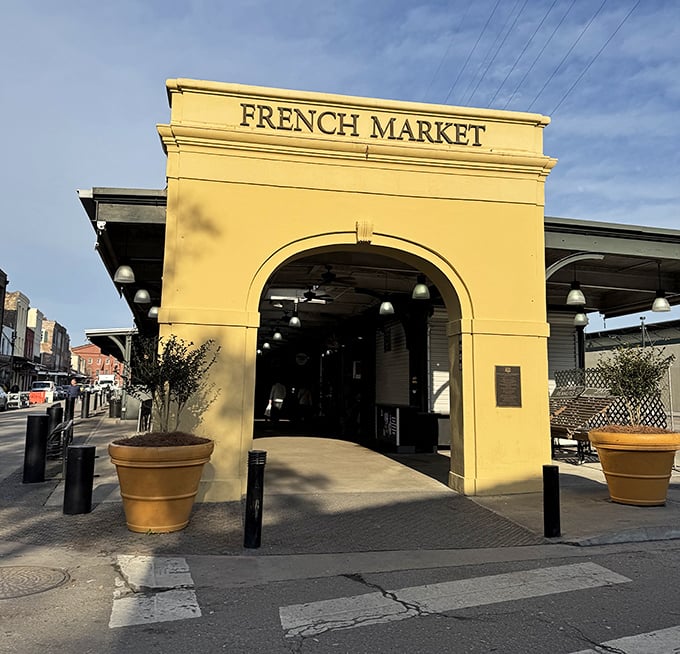 The sunshine-yellow archway stands like a portal to retail therapy, beckoning visitors with the promise of discoveries beyond.