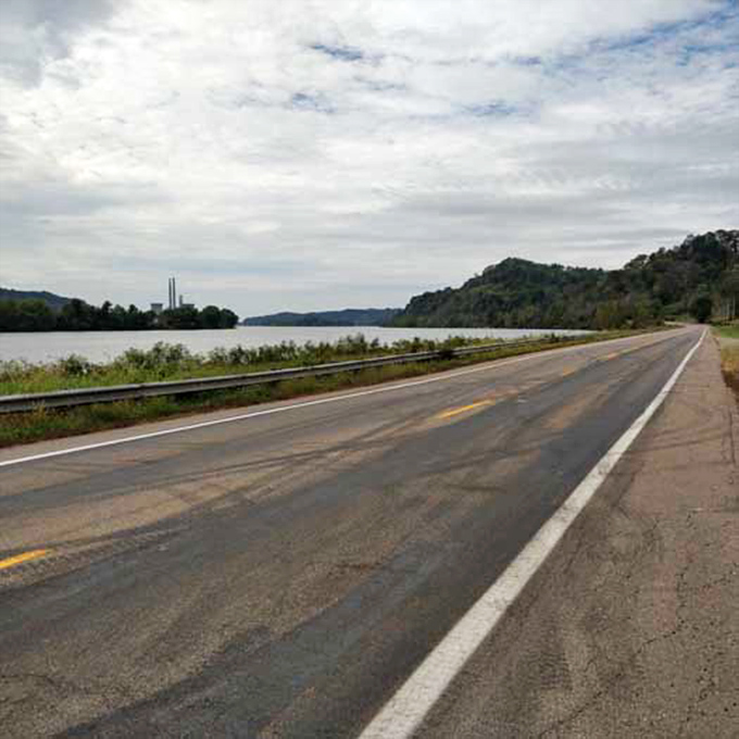 The road beckons with that "come hither" charm of a classic movie star&mdash;promising adventure while the river plays supporting role just beyond the guardrail.