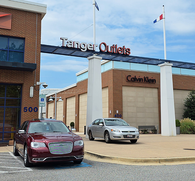 The entrance sign promises what every shopper dreams of: designer names without designer prices. Your wallet just sighed with relief.