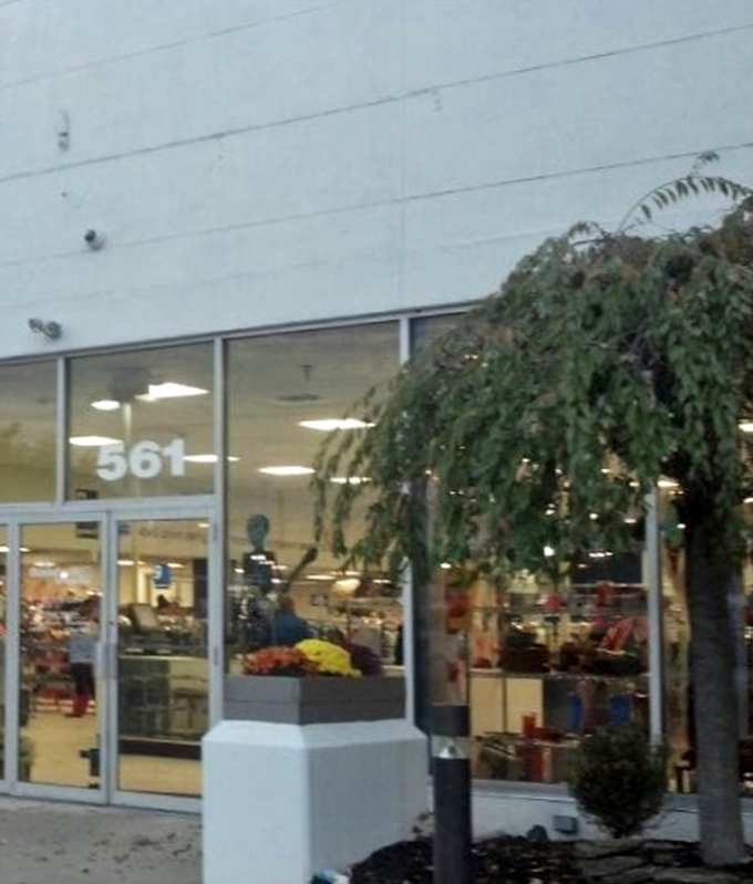 Step through these doors and leave your shopping budget anxieties behind. The entrance marks the threshold between retail regret and thrift triumph.