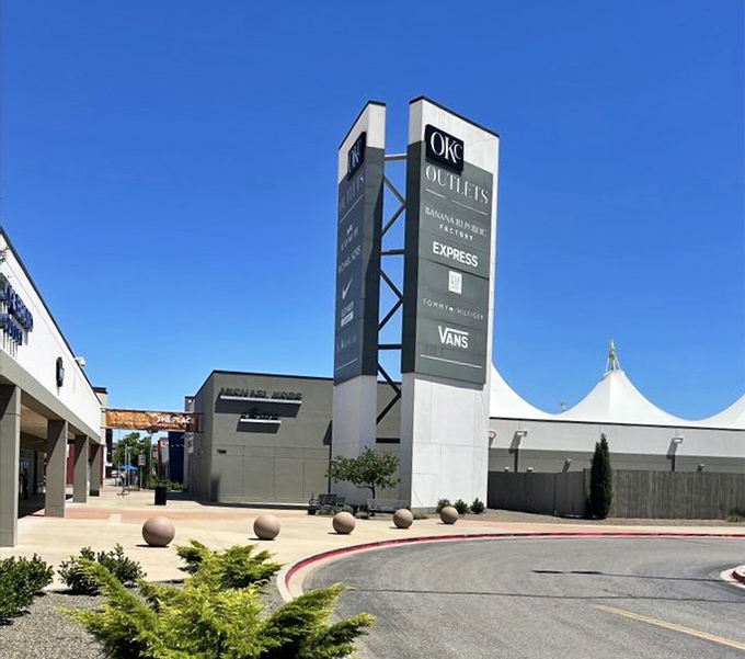Brand names that normally make your credit card whimper are displayed proudly on this towering sign of shopping salvation.