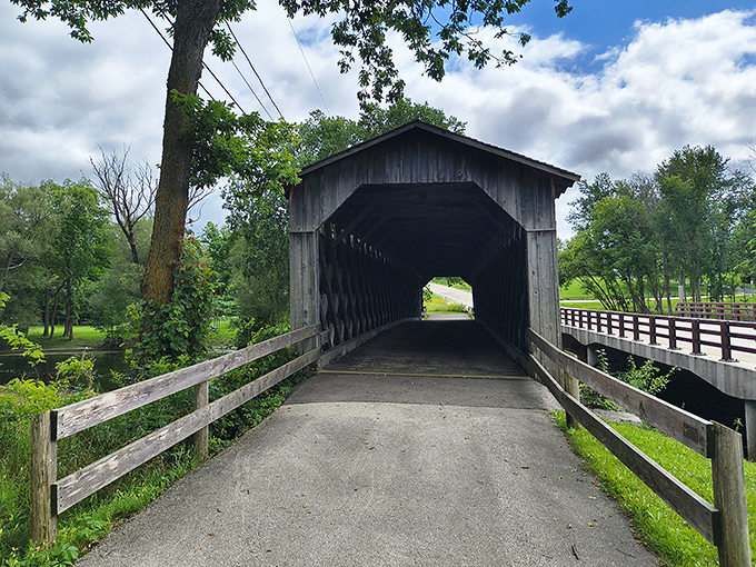 Step into yesterday through this wooden portal, where the lattice truss design creates a tunnel between modern life and simpler times.
