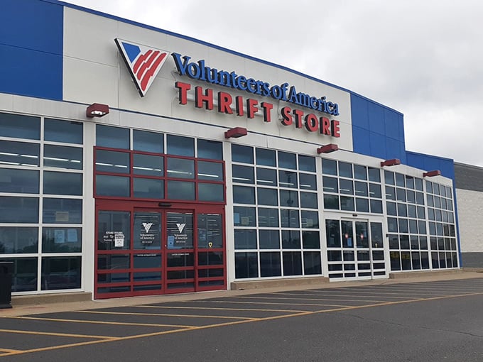 The bold blue and red exterior practically shouts "bargains inside" louder than a carnival barker on opening day. 