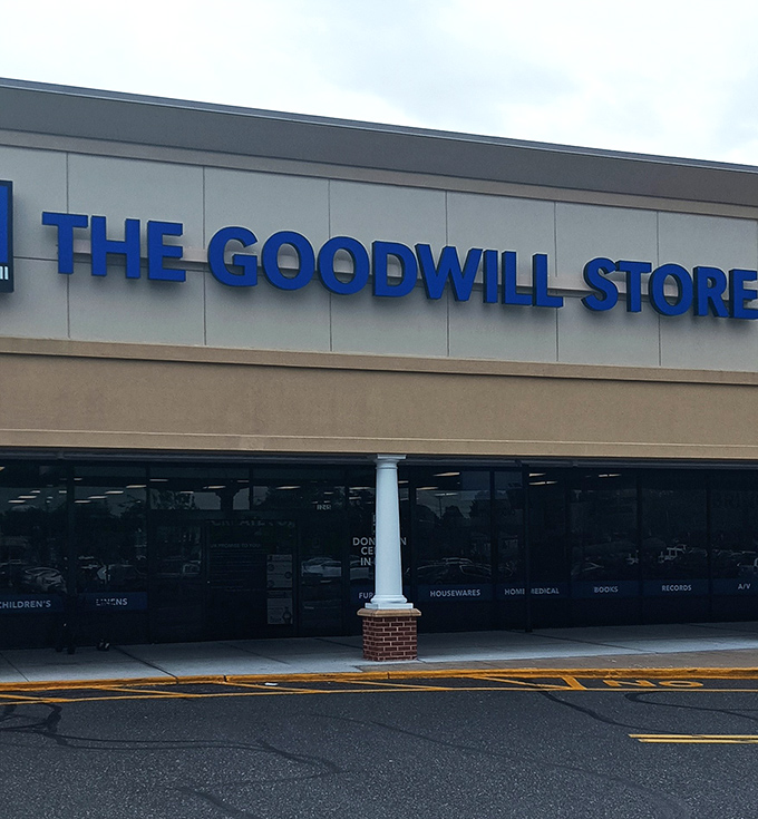 Bold blue letters against crisp white – like a retail lighthouse guiding thrifty shoppers safely to harbor.