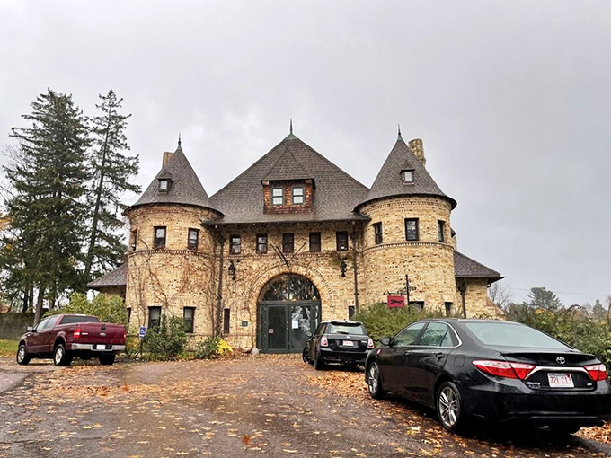 Autumn leaves frame this automotive fortress like nature's red carpet. Even on a cloudy day, the museum's stone turrets command attention like a medieval castle for motorcars.