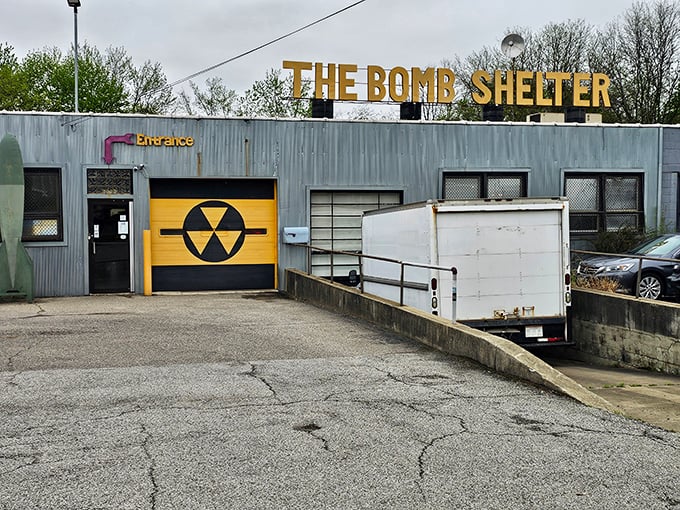 Rain or shine, that iconic yellow entrance beckons vintage enthusiasts like a time portal disguised as an industrial building.