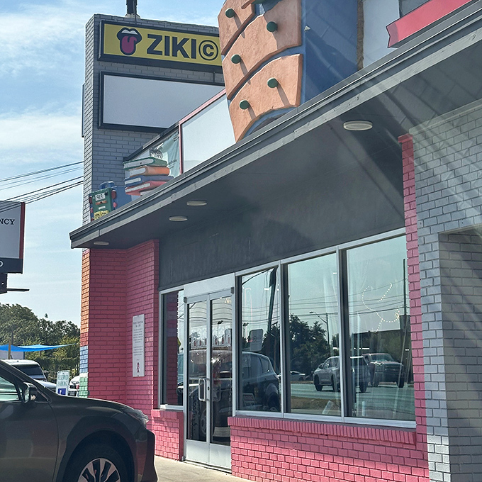 The pink brick storefront beckons like a portal to another era, where yesterday's castoffs become tomorrow's conversation pieces.