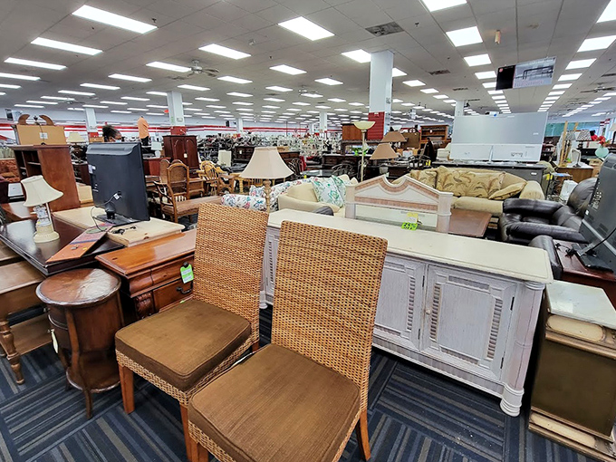 Furniture heaven awaits! Wicker chairs mingle with distressed white cabinets in what can only be described as a decorator's playground.