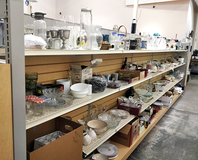 Glassware heaven awaits! From everyday tumblers to pieces that could've graced your grandmother's holiday table, each shelf tells stories of dinners past.