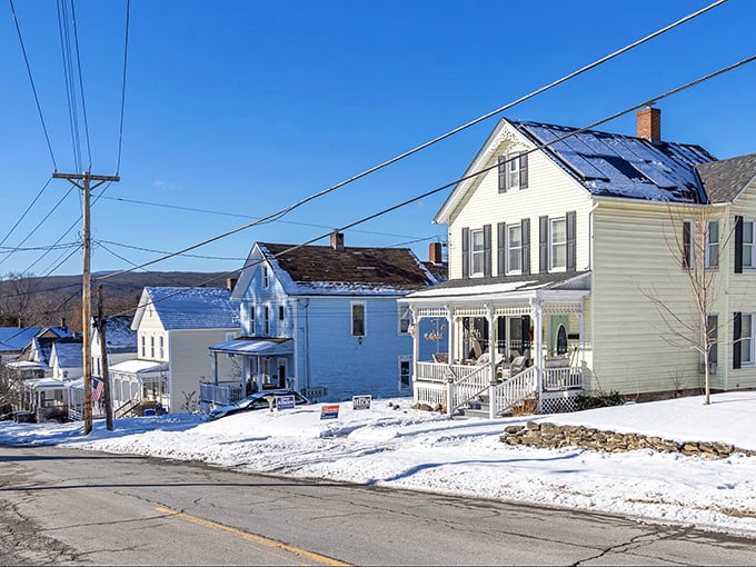 Winter blankets these classic Vermont homes in snow, transforming ordinary neighborhoods into scenes worthy of a holiday card collection.