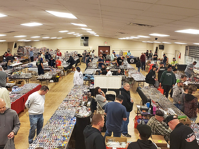 The indoor section buzzes with activity as collectors huddle over tables, each hoping to spot that one special find nobody else noticed.