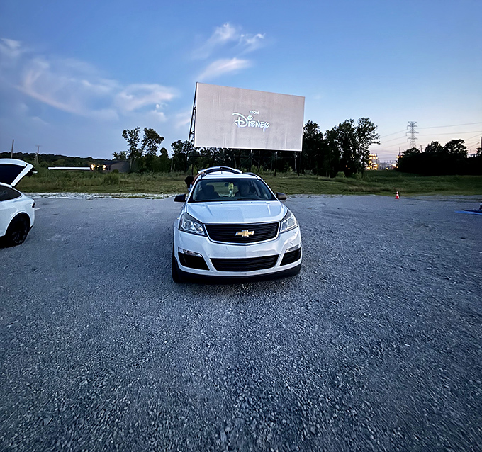 The Disney logo illuminates the massive screen, bringing Hollywood magic to this corner of Kentucky as dusk settles in.